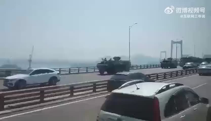 A convoy of PLA military equipment was spotted on the bridge between ...